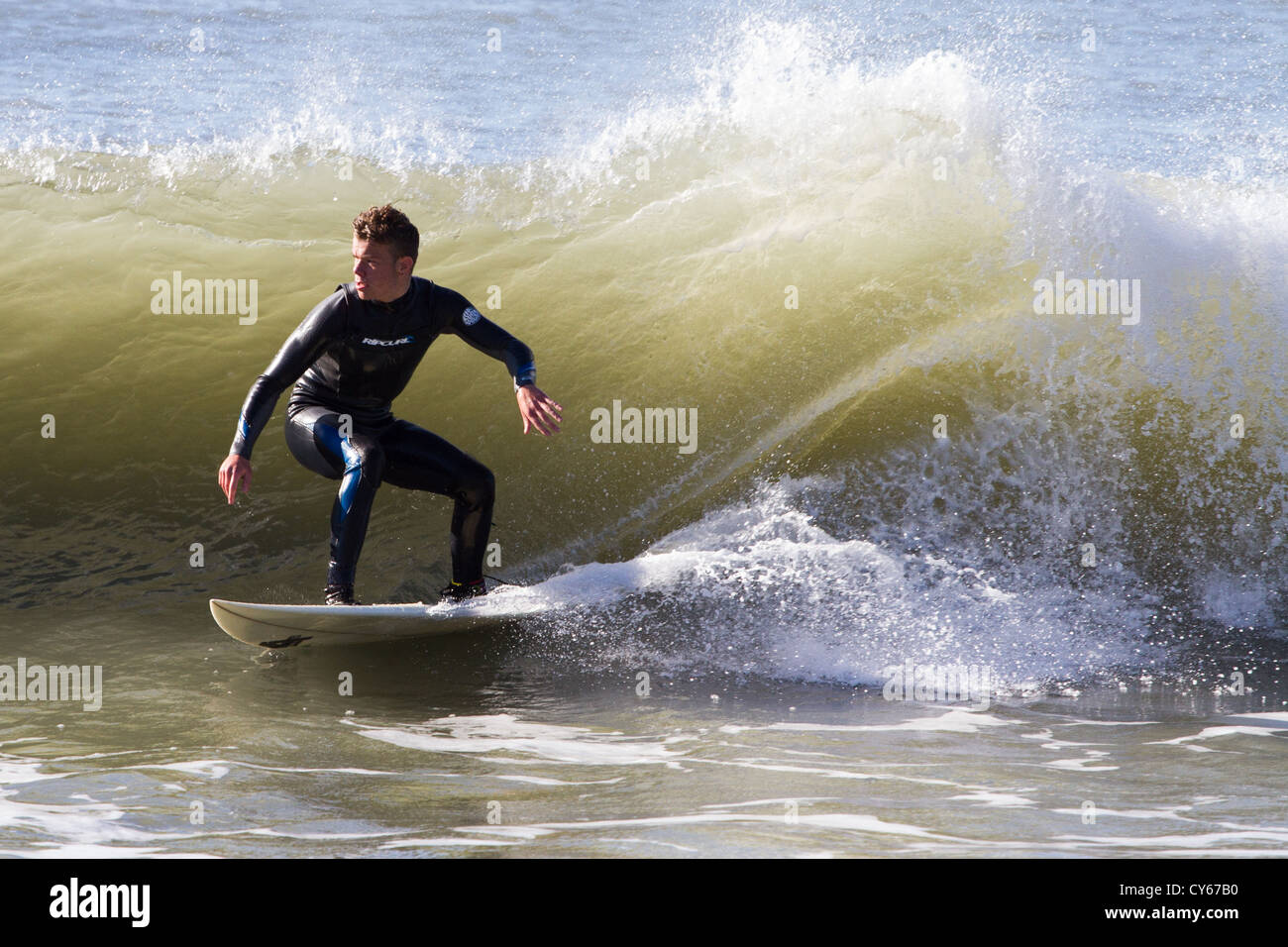 A surfer riding a wave Stock Photo - Alamy