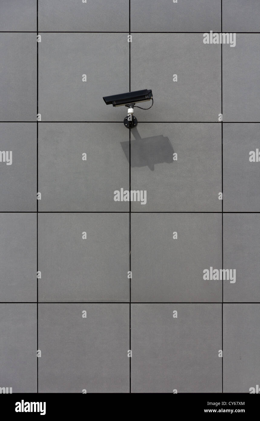 Big brother: Surveillance camera on tiled wall, aimed at his target ...