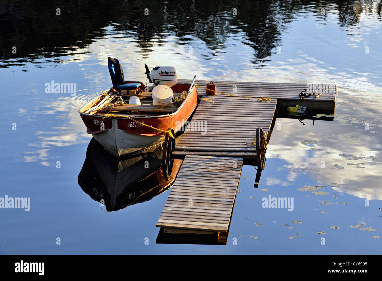 Fishing boat tied up to a dock on Elbow Lake, Wanup, Ontario, Canada ...