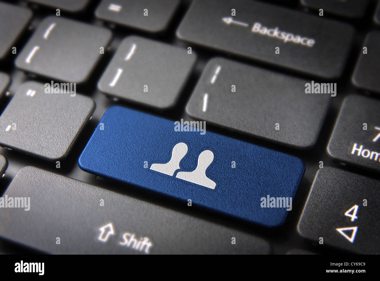Internet interaction key with two people icon on laptop keyboard ...