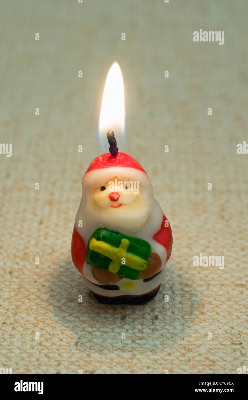 Burning Santa Claus Candle Stock Photo - Alamy
