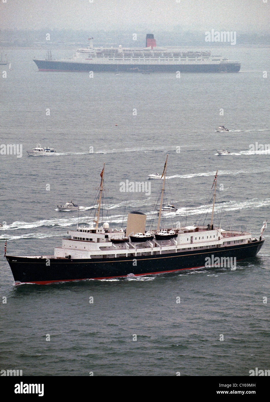 UK ENGLAND SPITHEAD Royal Yacht Britannia sails past Cunard liner RMS ...