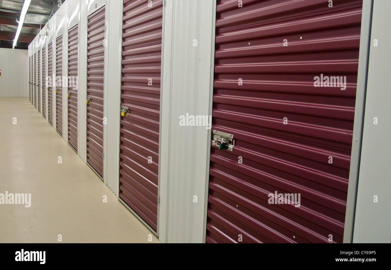 Interior storage units; purple storage unit doors and hallway Stock ...