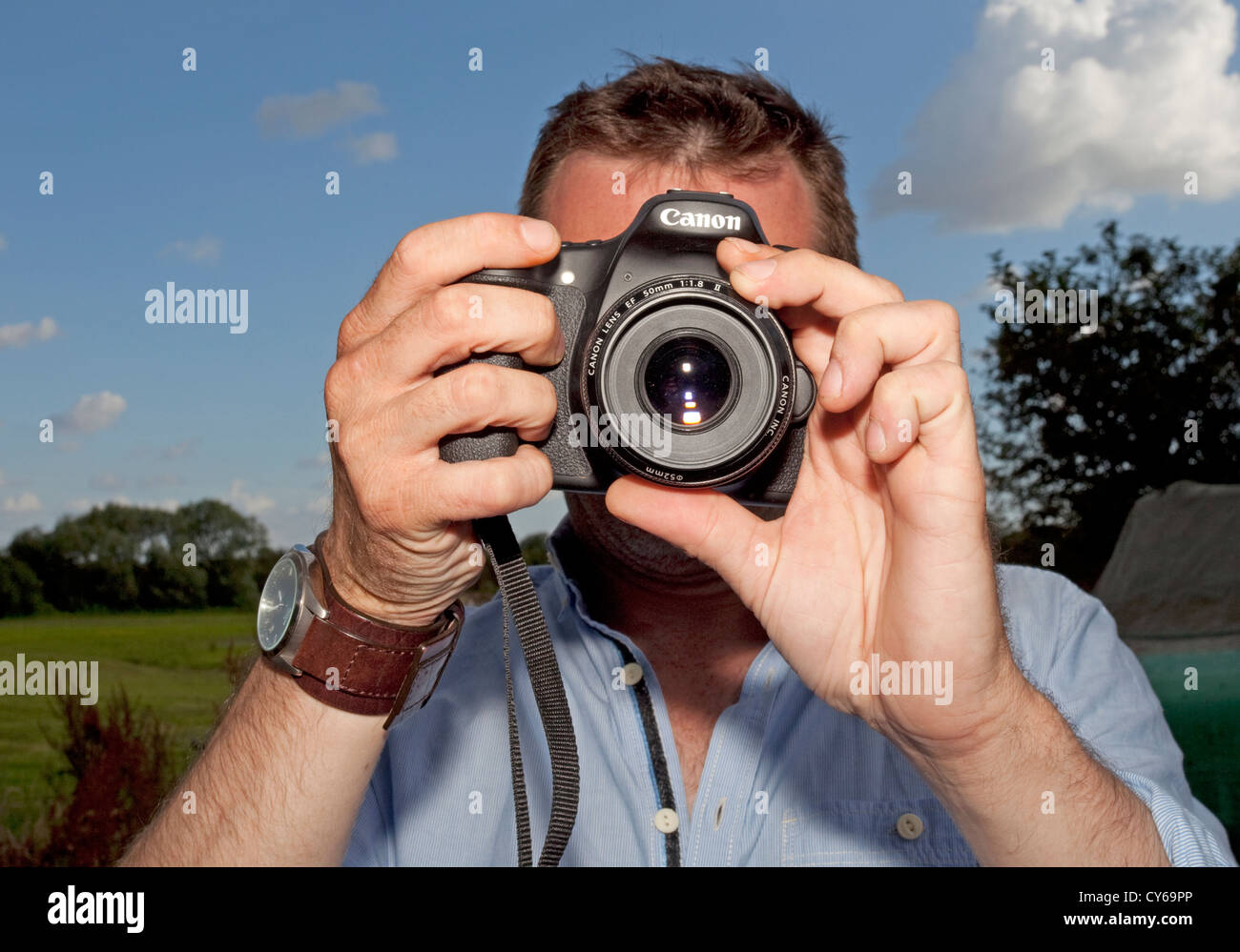 male photographing towards camera Stock Photo - Alamy