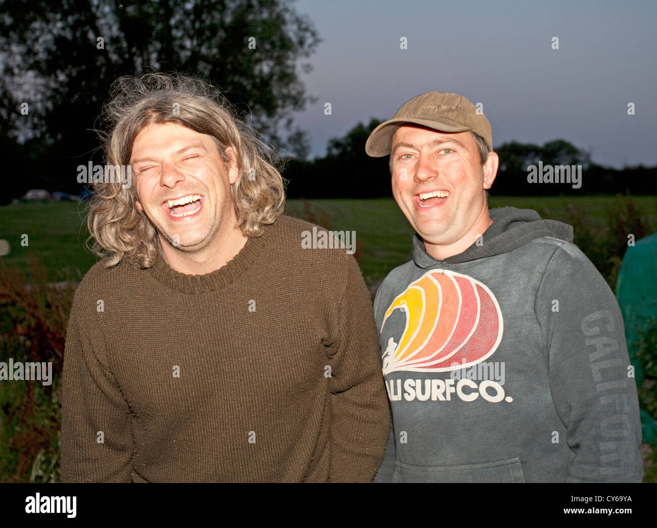 two men laughing towards camera Stock Photo - Alamy