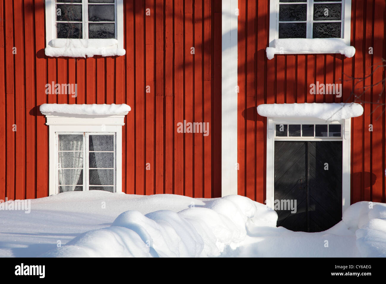 Facade of a red wooden house in winter Stock Photo - Alamy