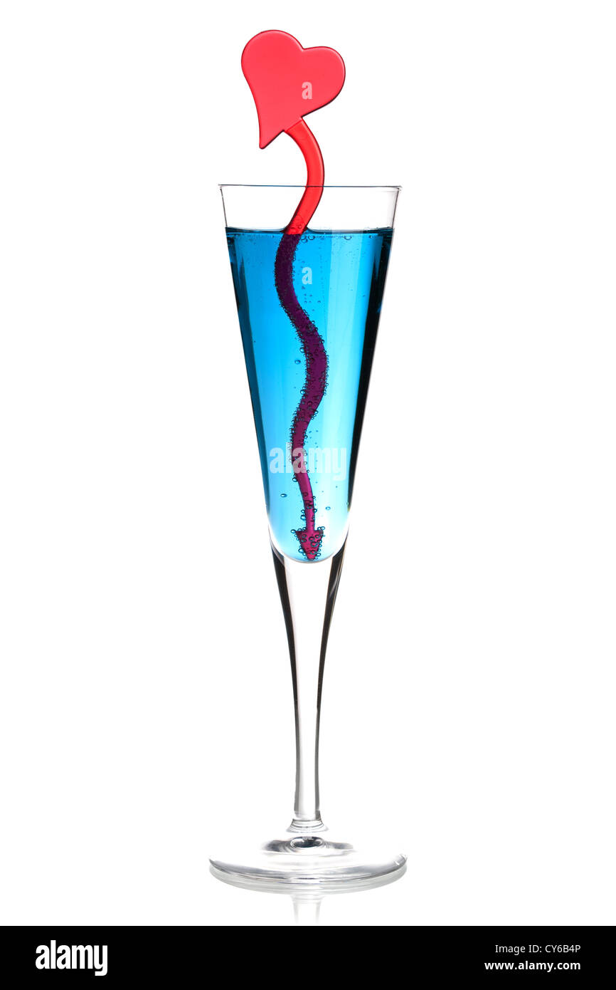 Blue champagne alcohol cocktail with red heart decoration. Isolated on ...