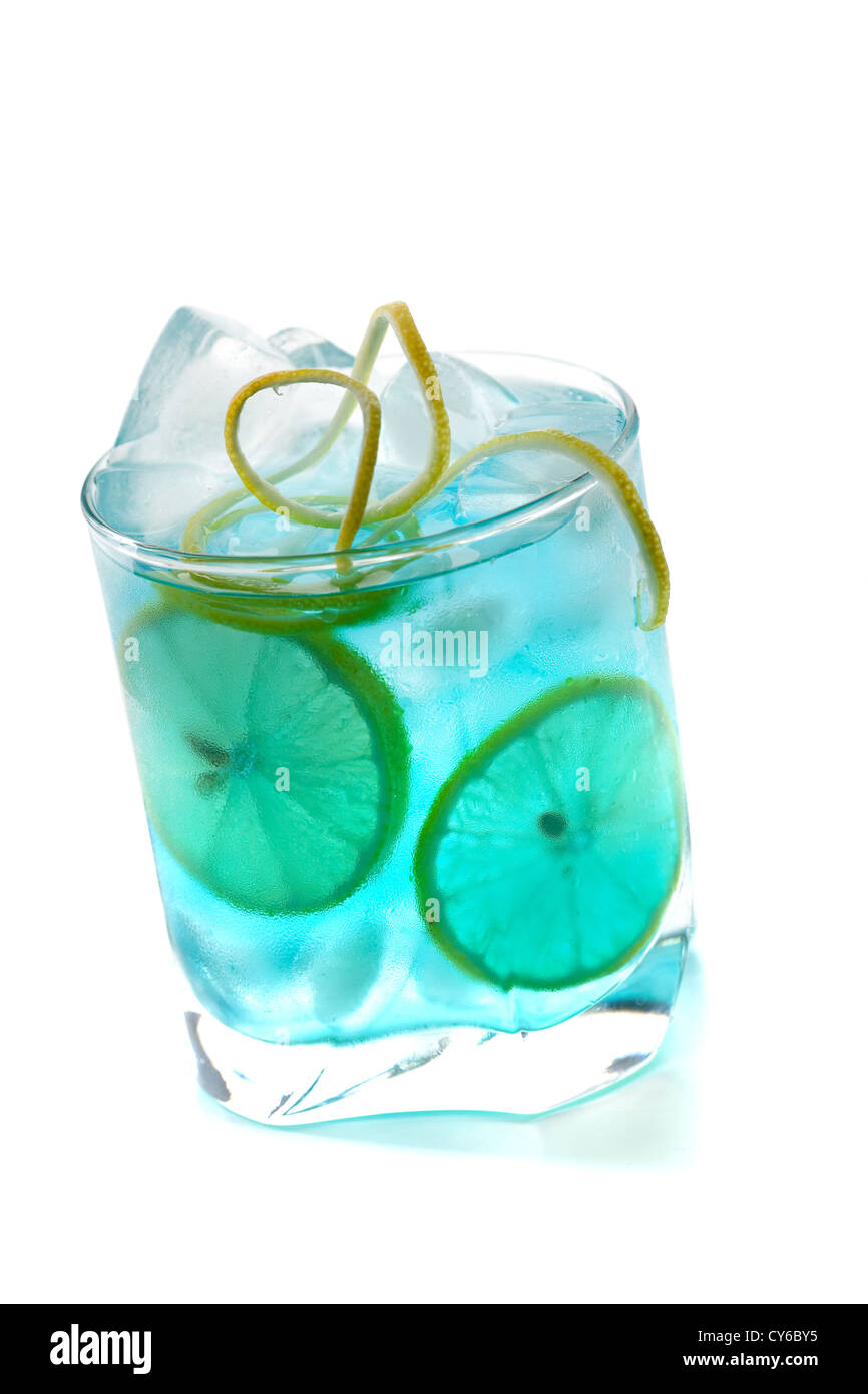 Blue alcohol cocktail with lemon slices isolated on white background ...