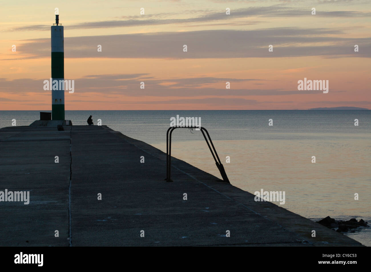 Aberystwyth stone jetty at sunset Stock Photo - Alamy