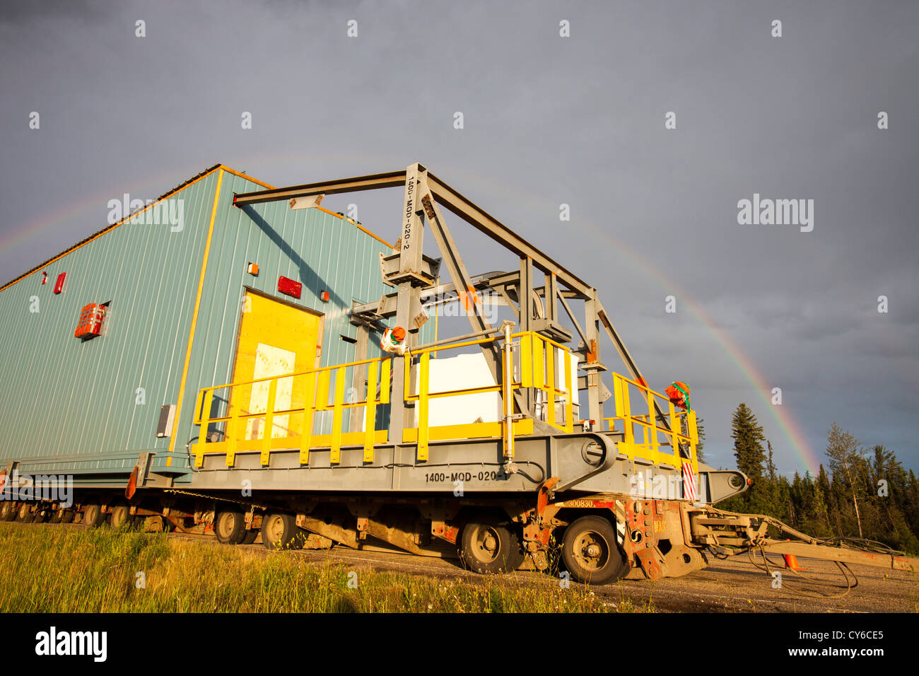 Trucks haul an oversize loadof tar sands equipment, on the road towards ...