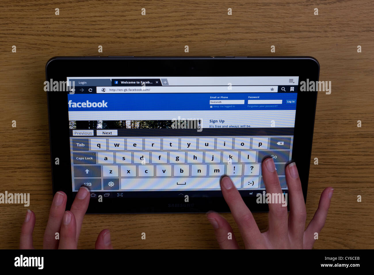 Typing on a Samsung Galaxy Tablet Stock Photo - Alamy