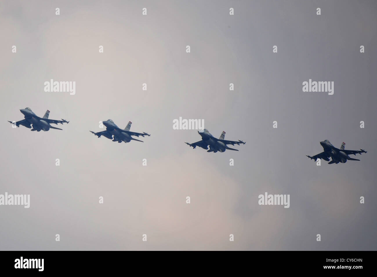 F-16 Fighting Falcons from the 36th Fighter Squadron perform a flyby ...