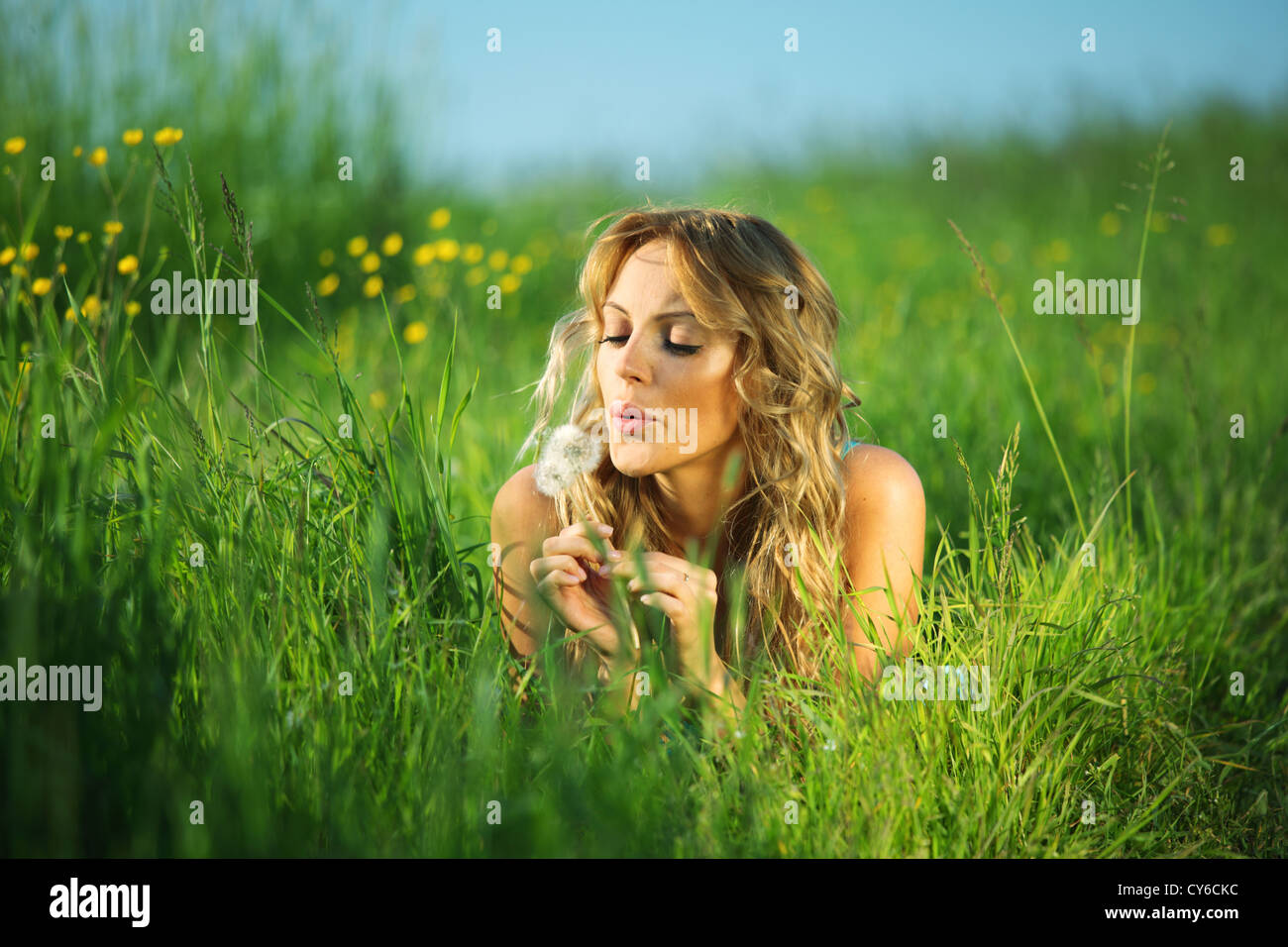 Smiley woman lying on hi-res stock photography and images - Alamy