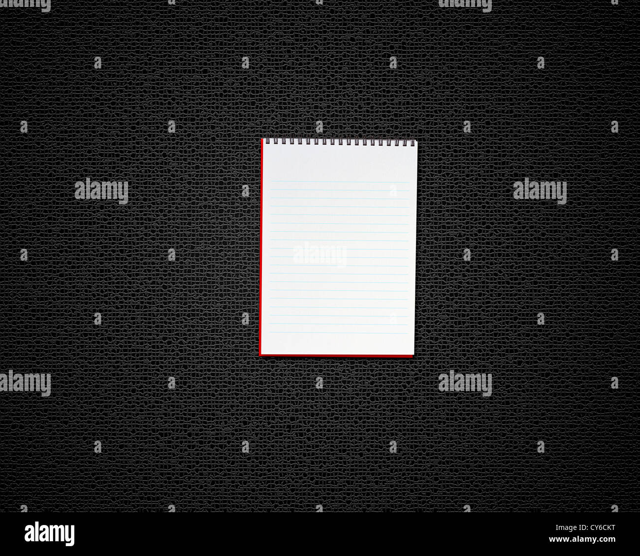 blank opened notebook on black background Stock Photo - Alamy