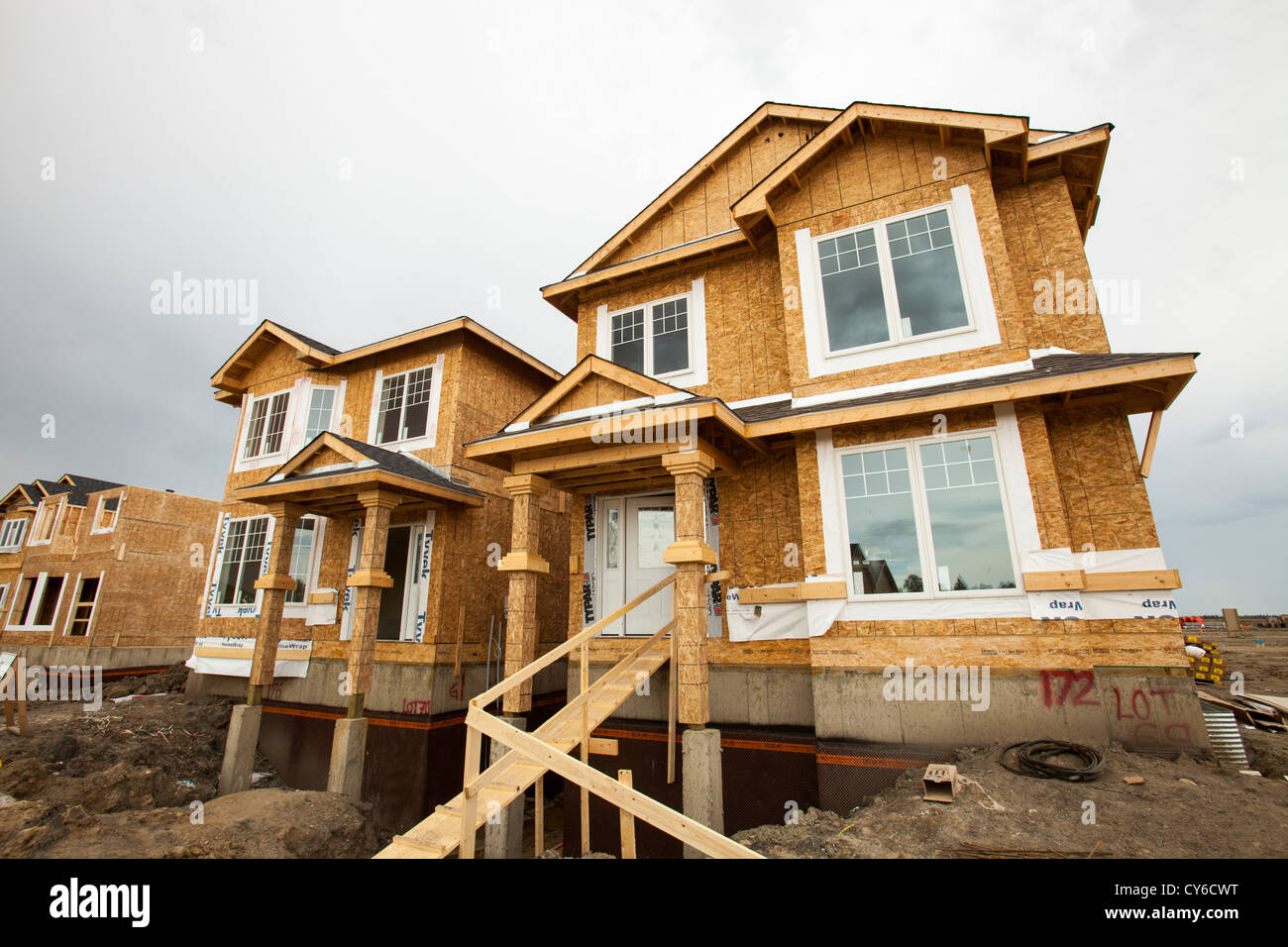 Construction workers rows new houses hi-res stock photography and ...