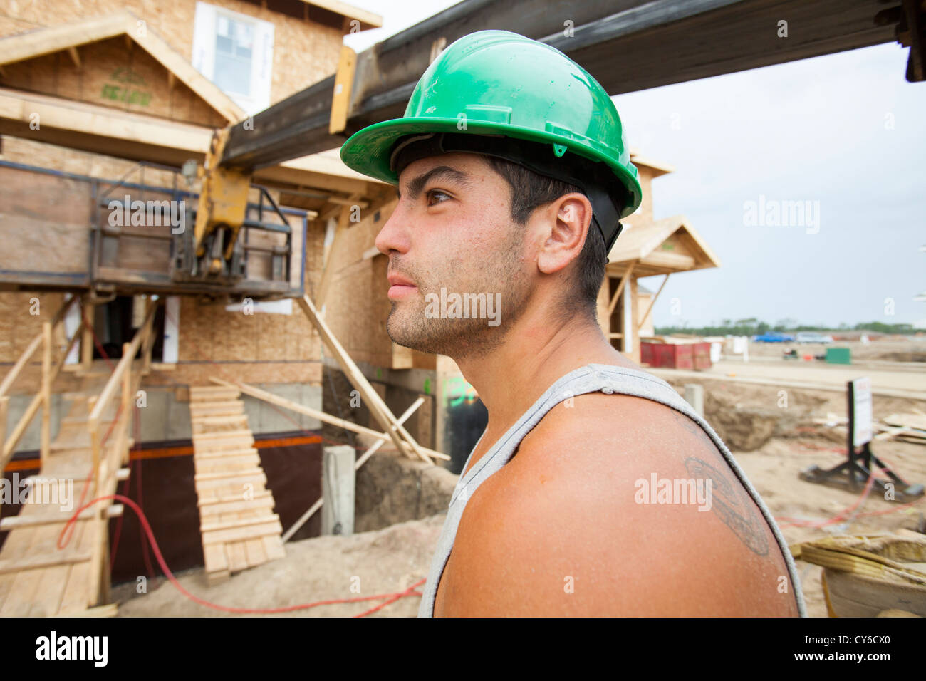 Construction workers rows new houses hi-res stock photography and ...