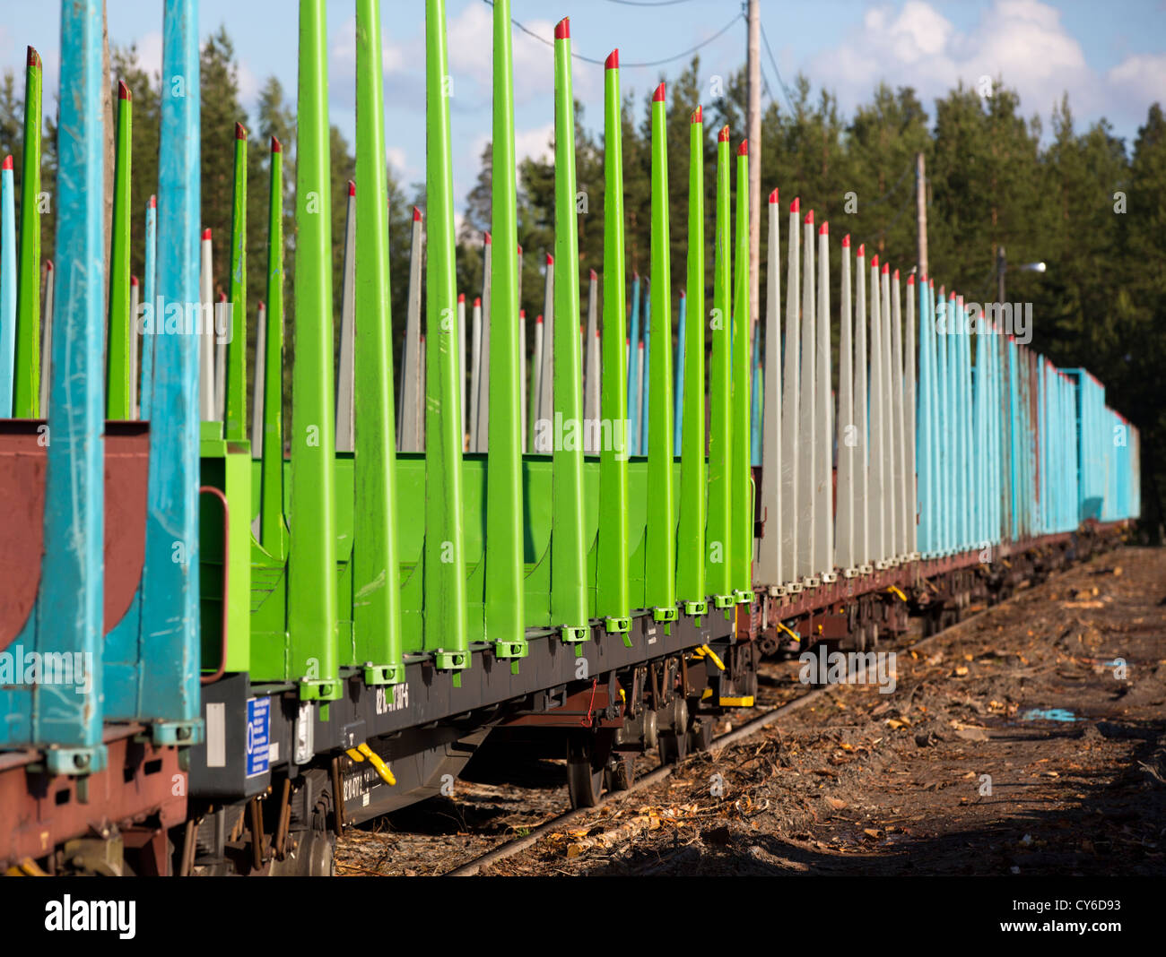 View of long empty cargo log train cars for transporting timber and ...
