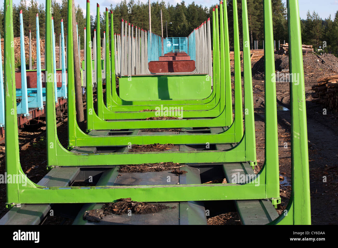 View of long empty cargo log train cars for transporting timber and ...