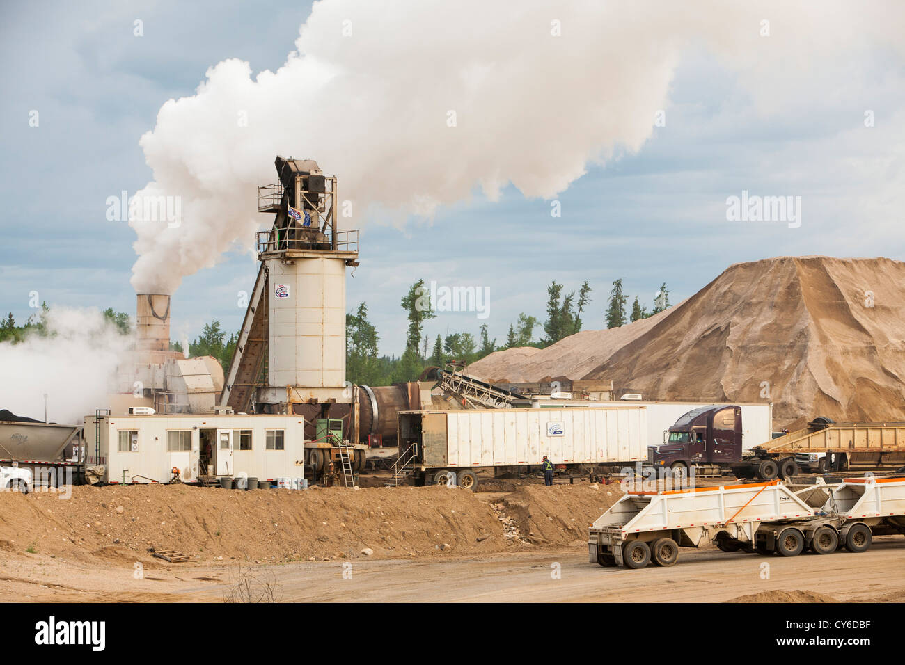 A sand and gravel strip mine producing materials to support the tar ...