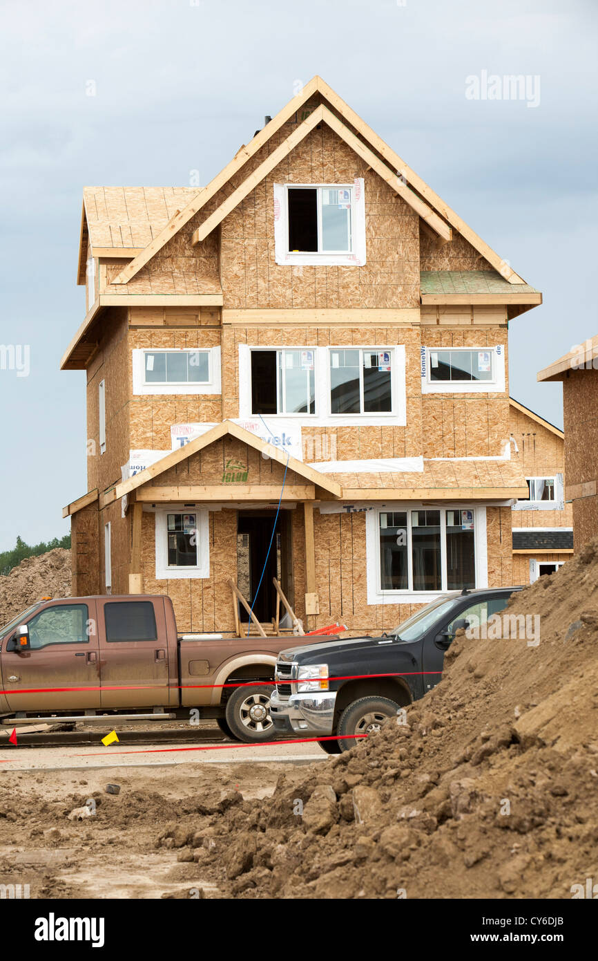 Construction workers rows new houses hi-res stock photography and ...