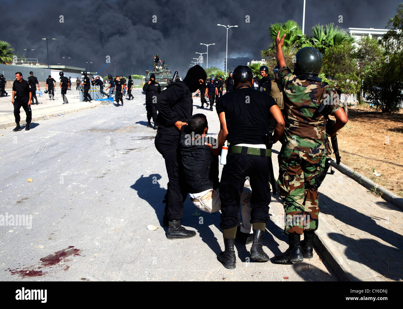 Police carry a wounded protester away during the attack on the US ...