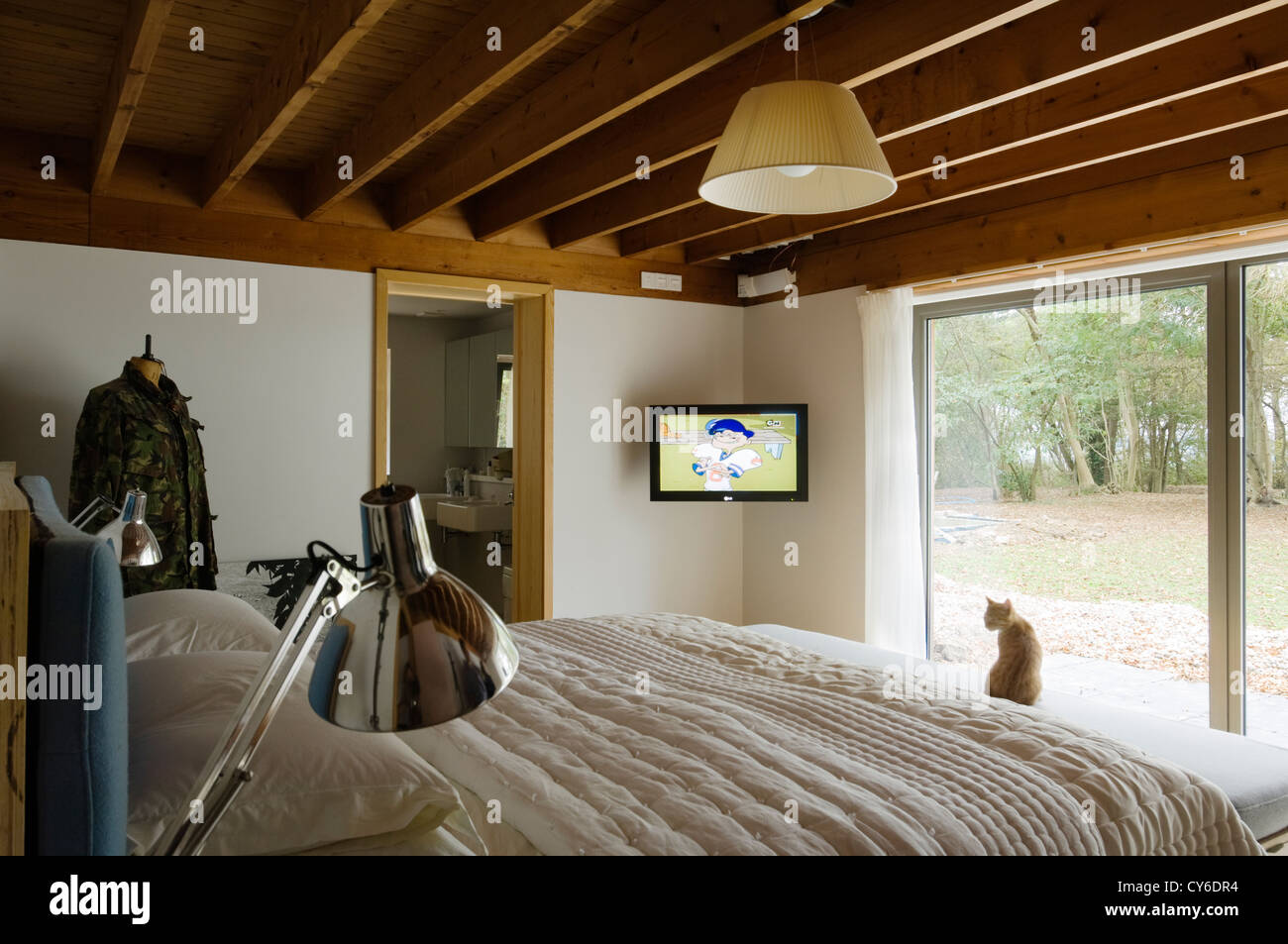 Bedroom with beamed wooden ceiling Stock Photo - Alamy