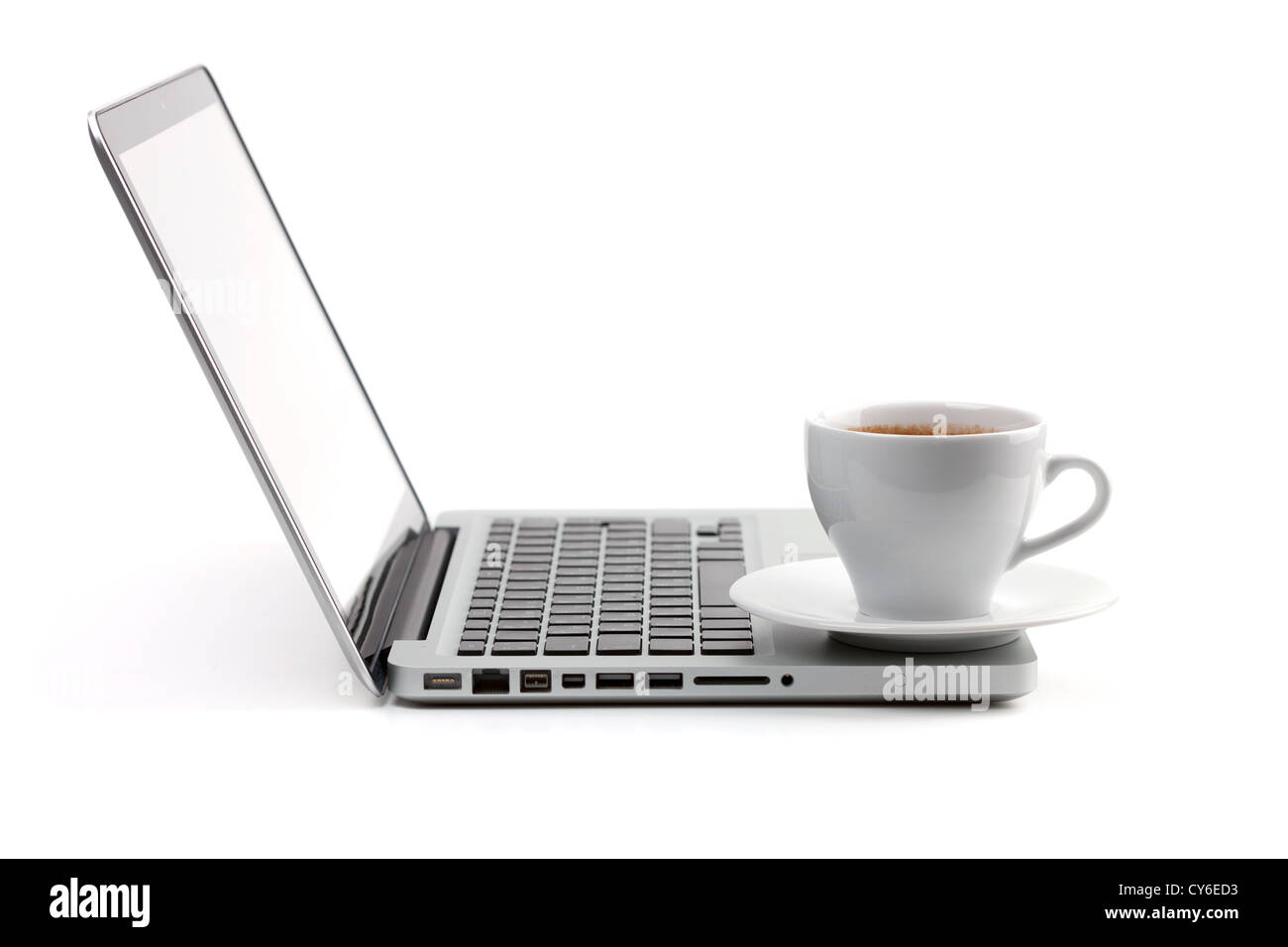 Cappuccino cup on laptop. Isolated on white background Stock Photo - Alamy