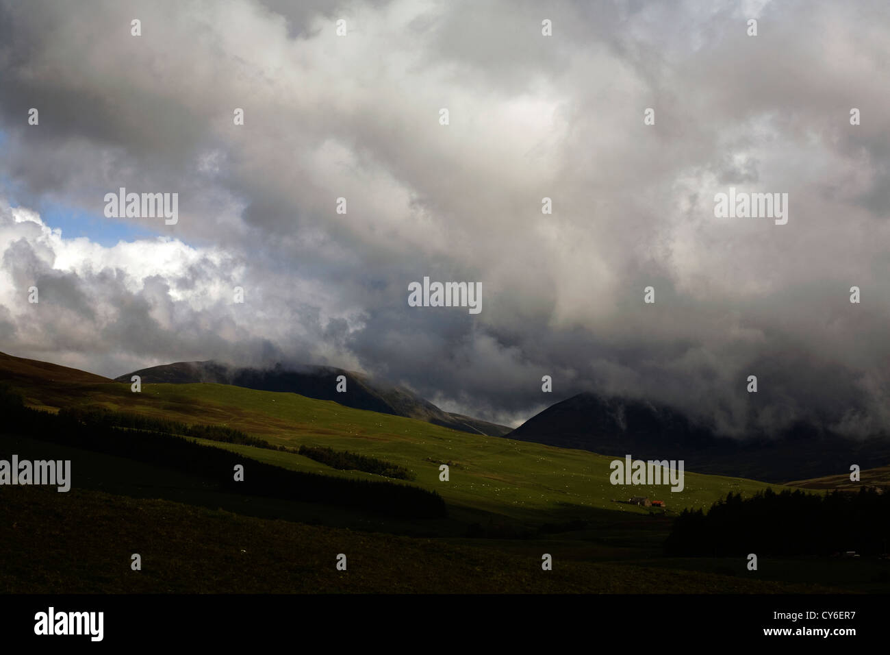 Storm clouds passing above Ben Vuirich Meall an Daimh and Ben Vrackie ...