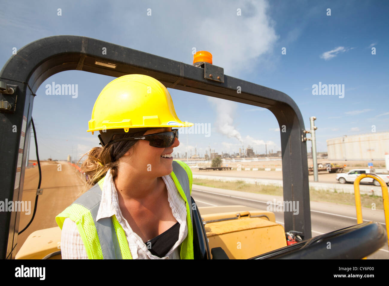Ali Walker drives a large road rolling machine at the Syncrude Mildred ...