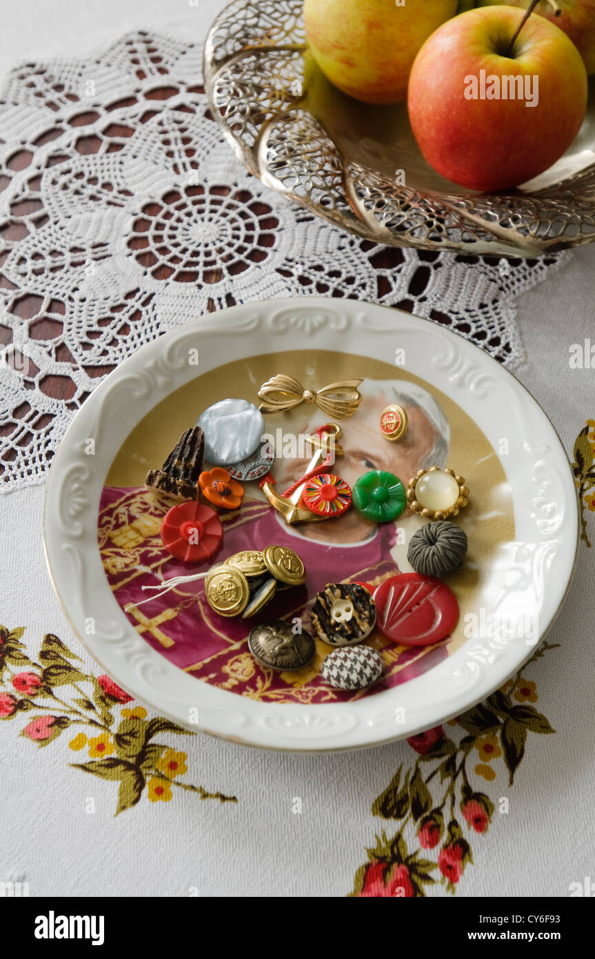 Pope plate and lacework on table with fruitbowl Stock Photo - Alamy