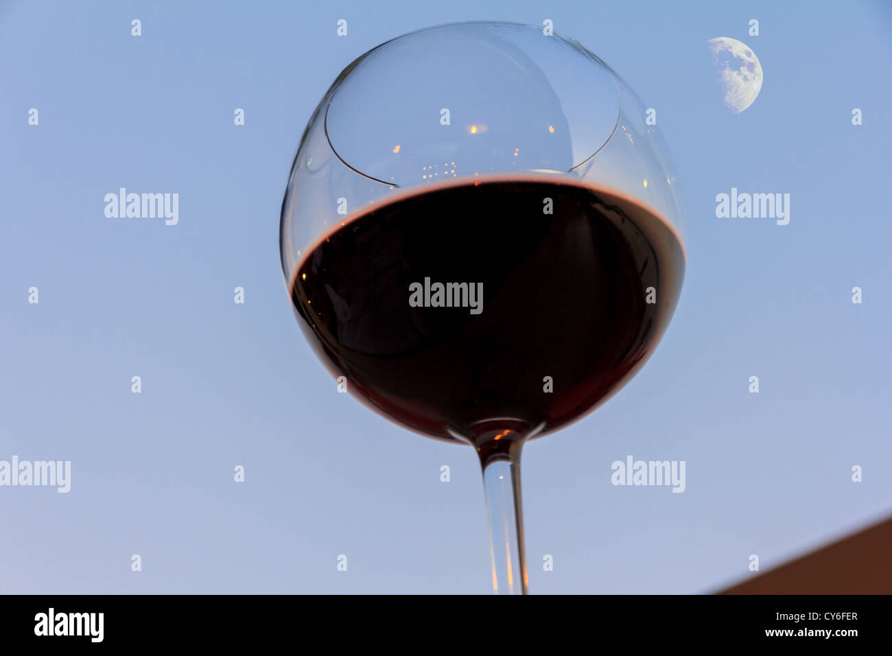 Glass of red wine and Moon in the sky in a romantic atmosphere Stock ...