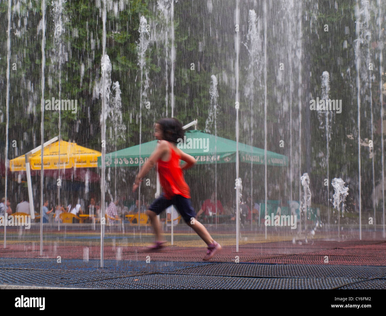 Children playing water jets hi-res stock photography and images - Alamy