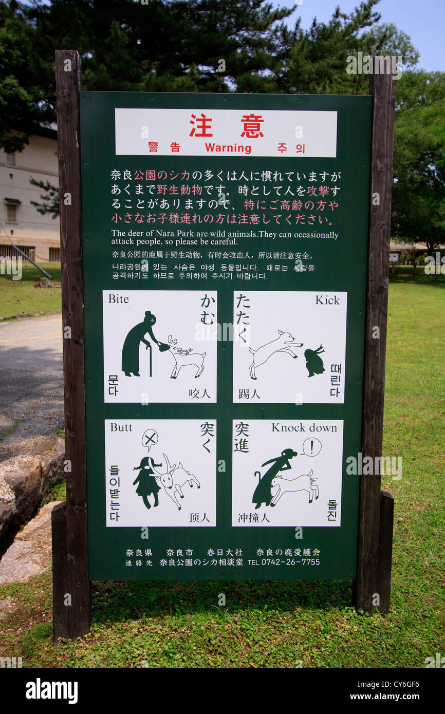 A warning sign about the wild deer which roam the parks and gardens of ...