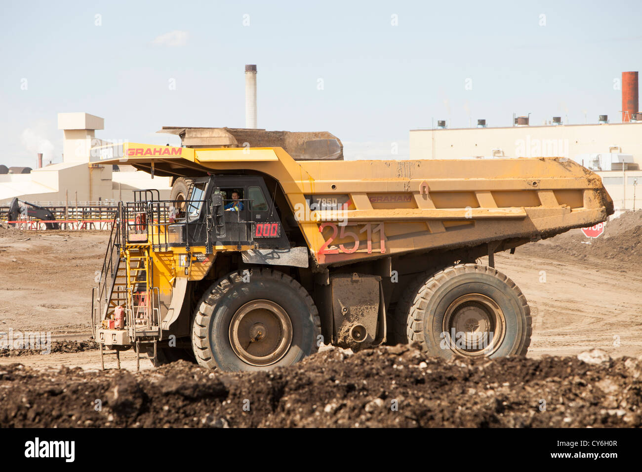 Massive dump trucks by the Syncrude upgrader plant. The tar sands are ...
