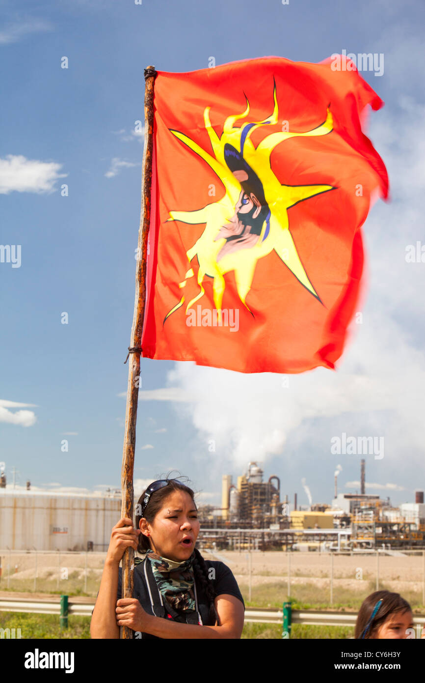 A First Nation Canadian protests against the destruction and pollution ...