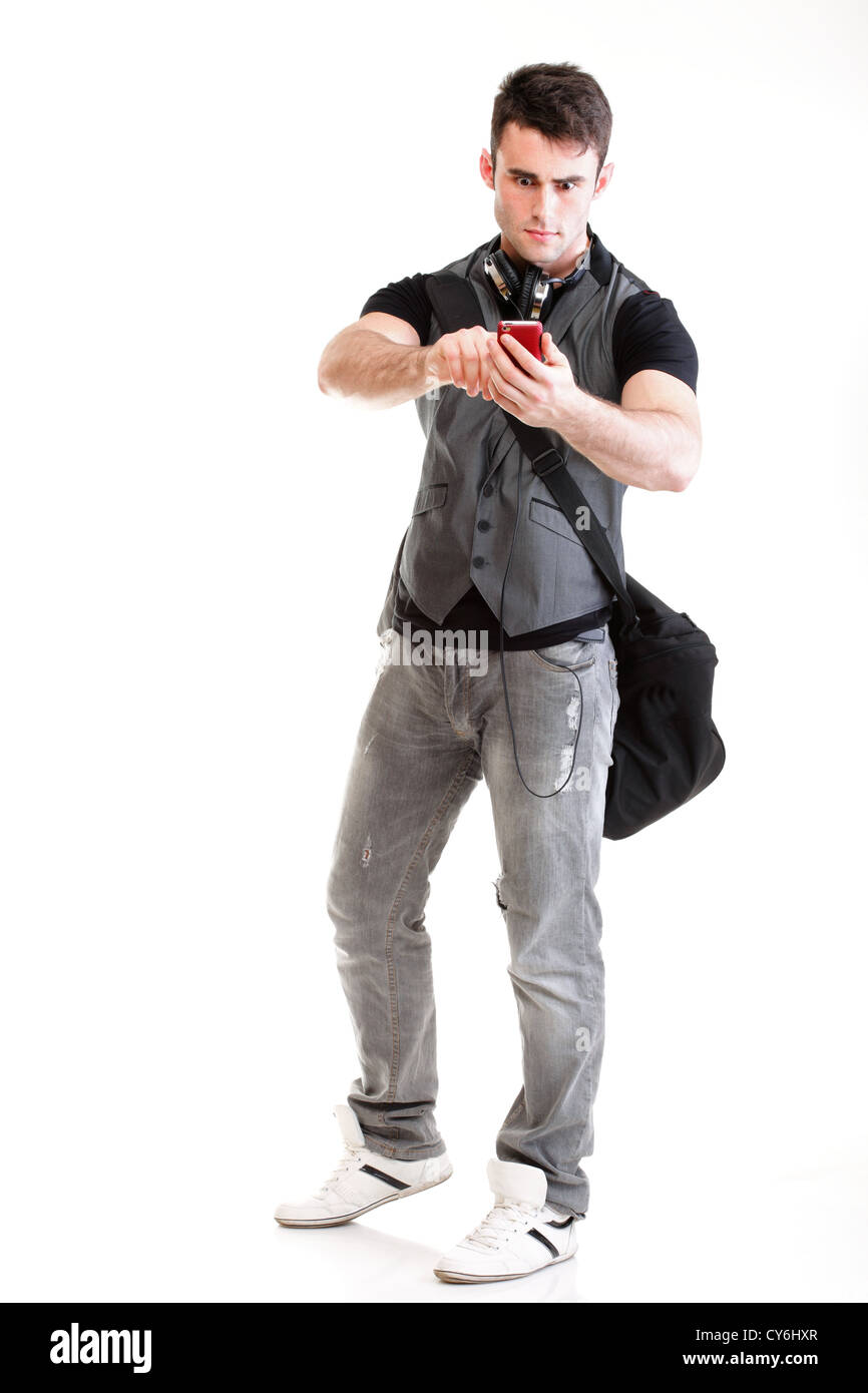 Full length portrait school boy with phone isolated on white. Music or ...