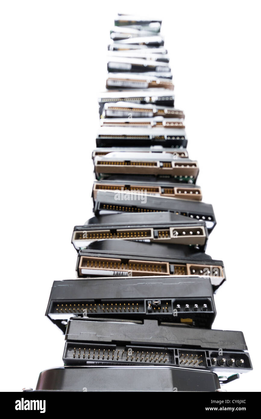 high stack of used hard drives in light background Stock Photo - Alamy