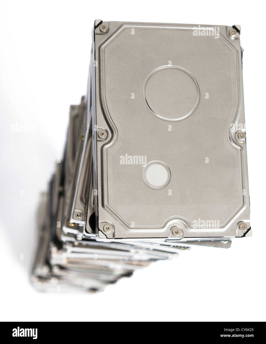 high stack of used hard drives in light background Stock Photo - Alamy