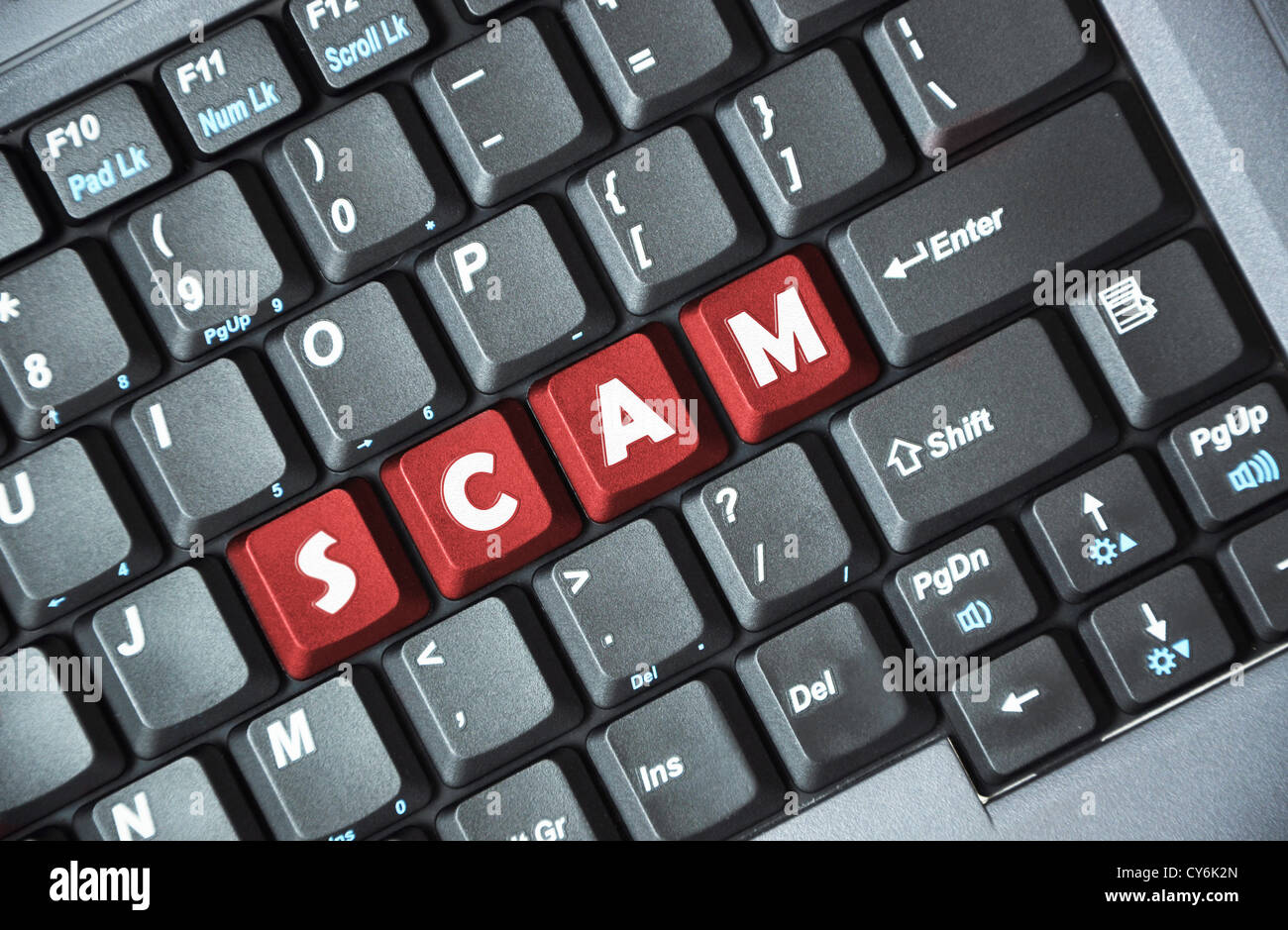Scam on keyboard Stock Photo - Alamy