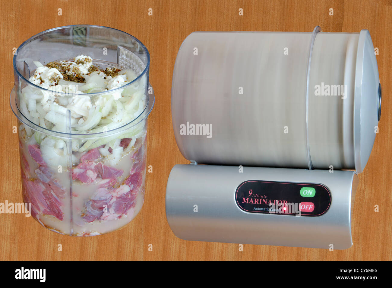 marinated meat in electrical marinator (filling bottles and rotation ...