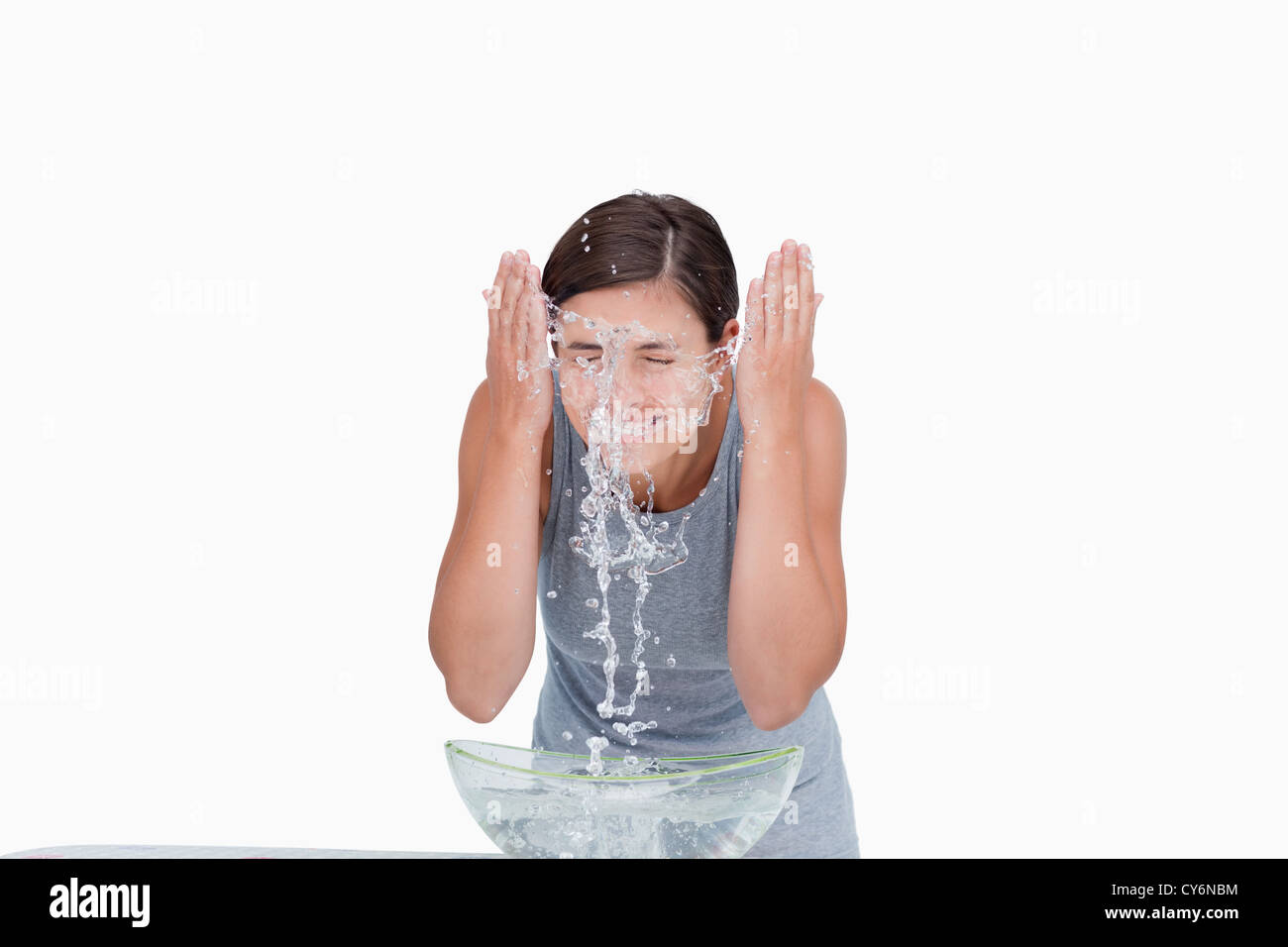 Young woman washing her face with a splash of water Stock Photo - Alamy