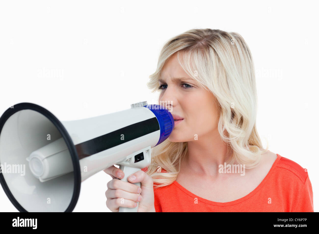 Young blonde woman speaking into a megaphone Stock Photo - Alamy