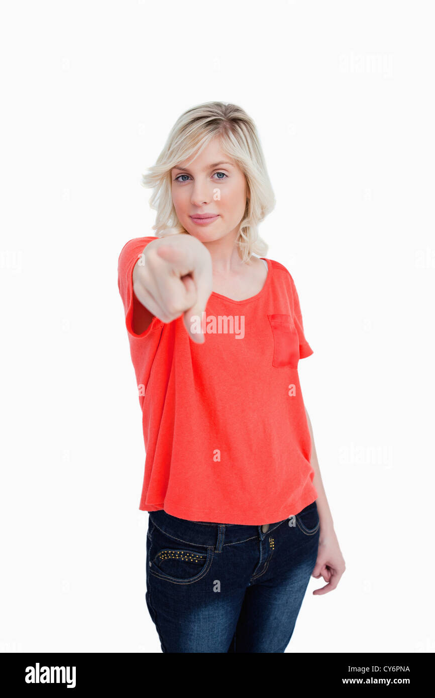 Young woman almost smiling while pointing her finger Stock Photo - Alamy