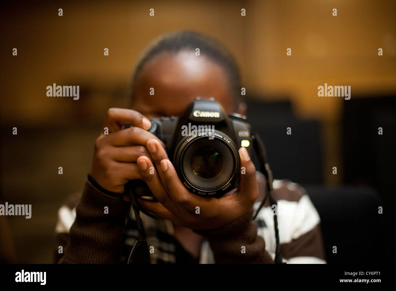 Black female African university student in classroom learning to take ...