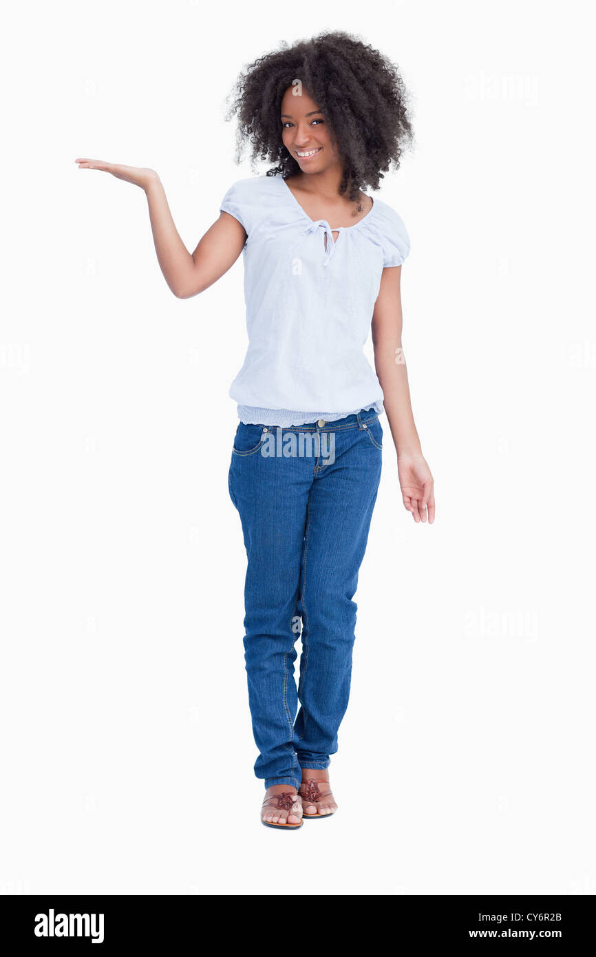 Young smiling woman putting her hand palm up Stock Photo - Alamy