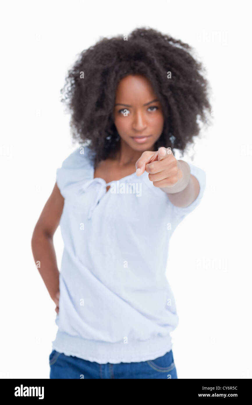 Young serious woman with curly hairstyle pointing her finger Stock ...