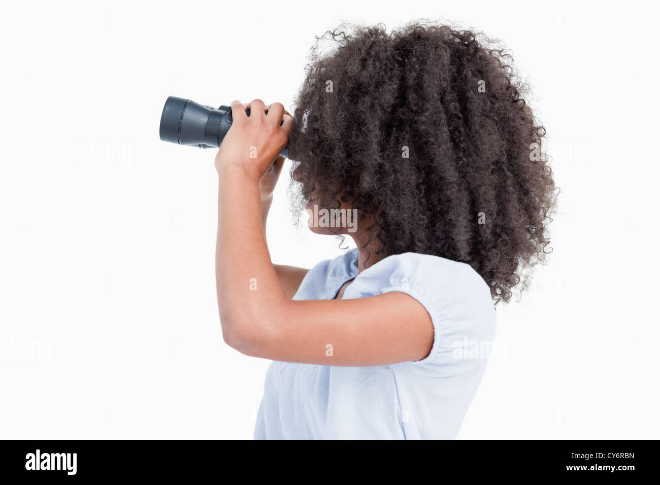 Side view of a young woman looking through binoculars Stock Photo - Alamy