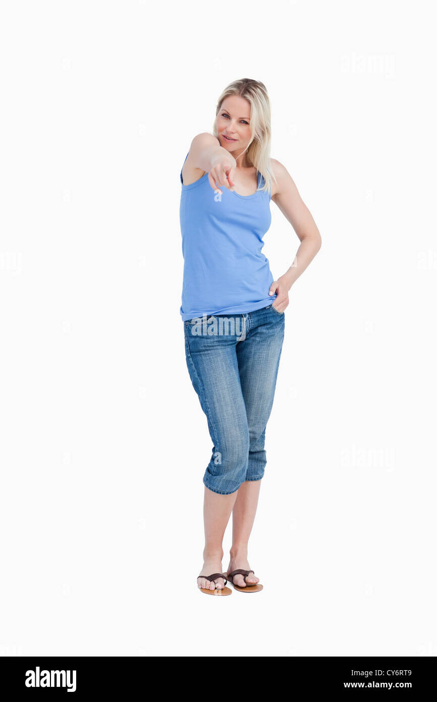Relaxed blonde woman pointing her finger Stock Photo - Alamy