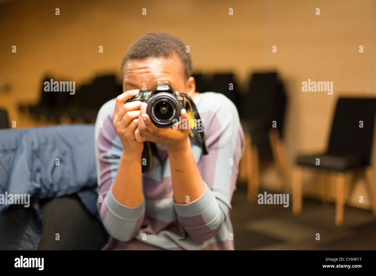 Black female African university student in classroom learning to take ...