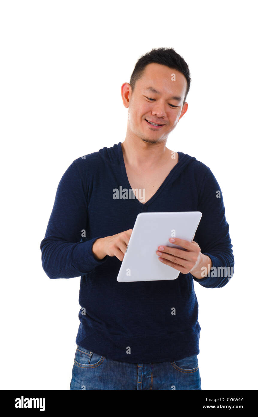 happy asian male on a generic tablet Stock Photo - Alamy